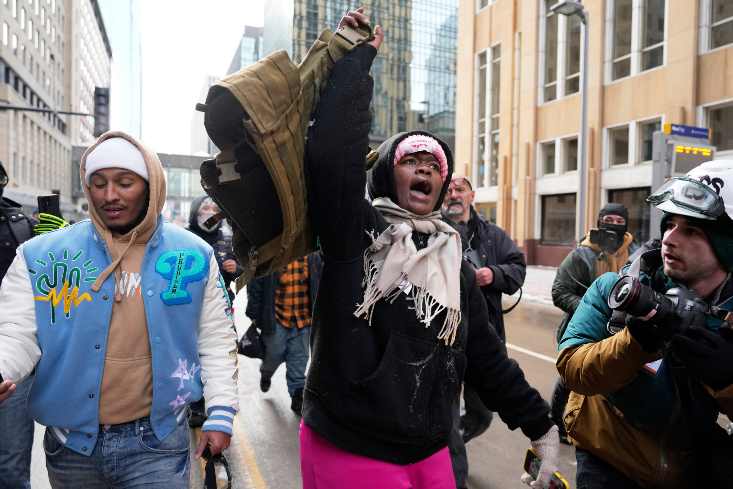 Pro- and anti-ICE demonstrators face off during Minneapolis immigration ...